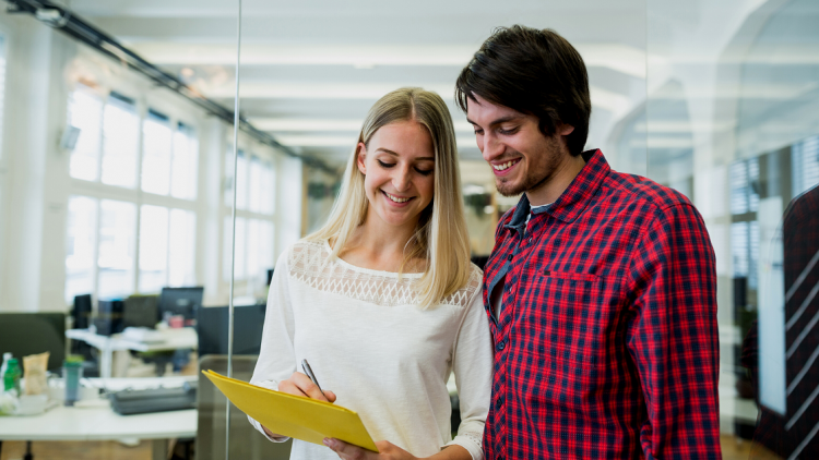 10 Visible Signs A Female Coworker Likes You